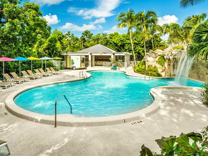 Dive into serenity! Baker's Cay Resort's crystal-clear pool with its cascading waterfall creates an oasis that makes you forget emails even exist.
