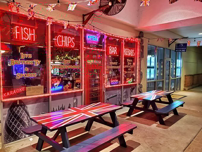 Sundays Grill's vibrant British-themed exterior lights up with neon signs promising authentic fish, chips, and kebabs &ndash; a little piece of London in sunny Florida.
