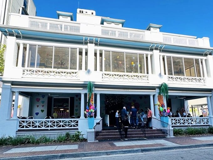 Sweet Pete's white Victorian facade welcomes candy lovers with colorful decorations and charming balconies &ndash; a sugar paradise in historic downtown Jacksonville.