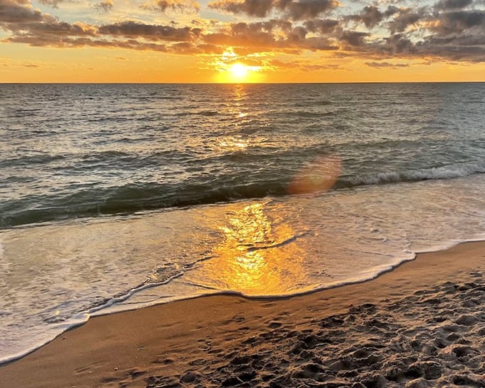 Golden hour magic at Bowman's Beach, where sunset transforms the Gulf waters into a shimmering pathway of light perfect for evening strolls.