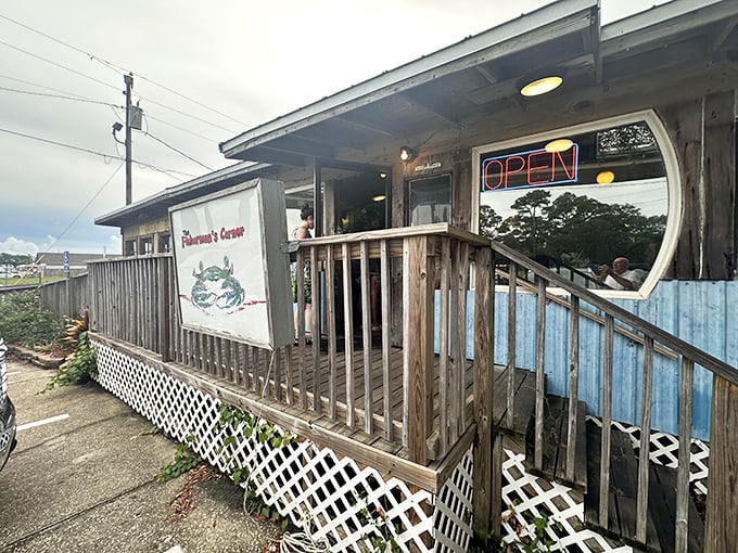 A closer look at Fisherman's Corner reveals its charming coastal character. The weathered wood and simple sign speak volumes about their focus on food over frills.