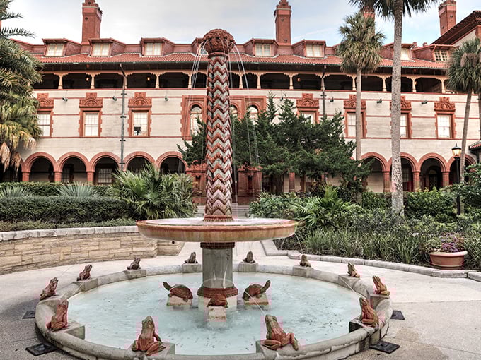 The iconic courtyard fountain at Flagler College features playful frogs and turtles, creating a peaceful oasis amid Spanish Renaissance splendor.