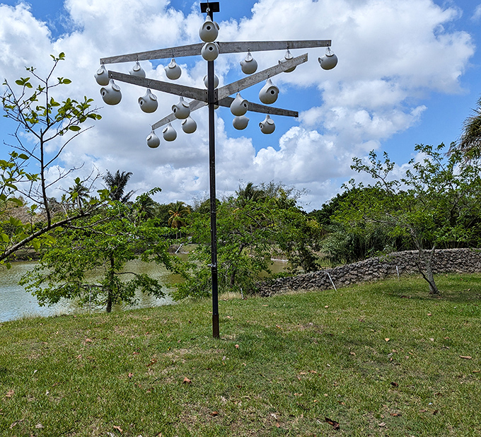 This unusual musical sculpture at Fruit & Spice Park turns gentle breezes into melodies, surrounded by tropical greenery.