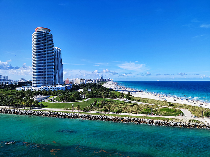 The iconic Miami Beach shoreline stretches into the distance, where luxury high-rises meet turquoise waters and pristine beaches perfect for soaking up the Florida sunshine.