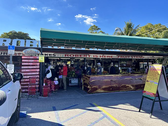 Customers browse the colorful selection at Robert Is Here, where tropical fruits and famous milkshakes have made this Homestead institution a must-stop for decades.