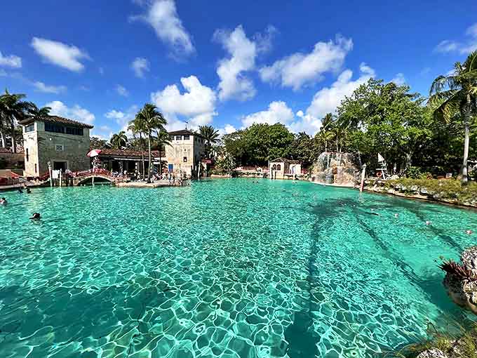 Crystal-clear spring water fills this historic swimming hole, making every dip feel like a tropical escape.