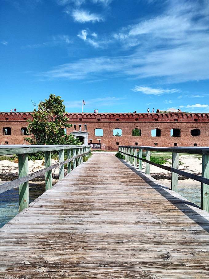 Fort Jefferson welcomes visitors across a wooden boardwalk that might as well be labeled "entrance to paradise." The brick walls have stories to tell.