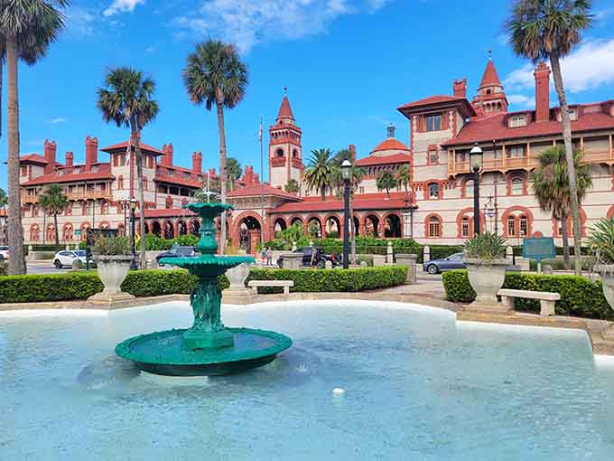 Nothing says "welcome to paradise" quite like a fountain surrounded by palm trees and a building that looks like royalty designed it.