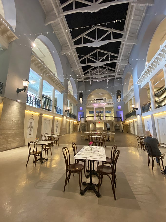 Not your average dining room ceiling! The original pool infrastructure creates a cathedral-like atmosphere where conversations echo like whispered secrets.