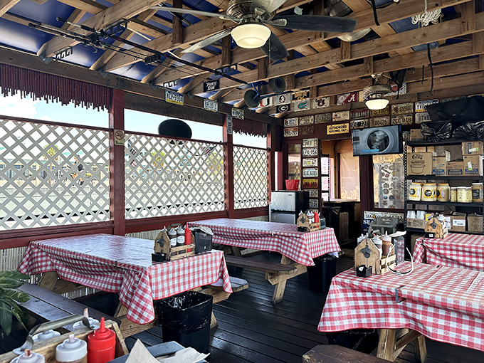 Red-checkered tablecloths and wooden beams create the perfect rustic backdrop for the serious business of barbecue appreciation.