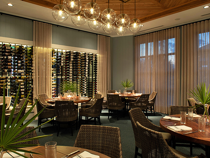 The dining room whispers "coastal elegance" without shouting "pretentious." Those bubble glass pendants mimic water droplets &ndash; a touch that deserves its own round of applause.