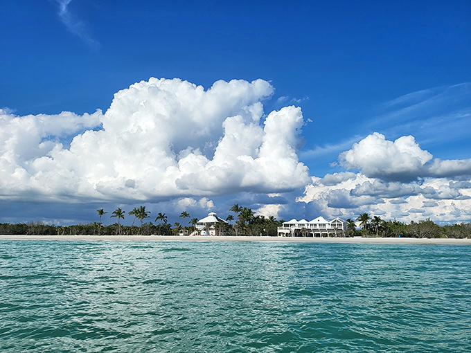 Mother Nature showing off again with that perfect blend of turquoise water, white sand, and cloud formations that look professionally arranged.