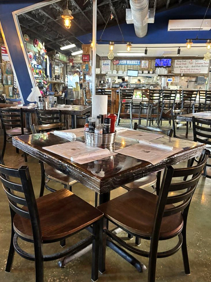 Inside Walt's, nautical charm meets serious seafood business. The blue walls and wooden tables create that "just stepped off the boat" feeling we all crave.