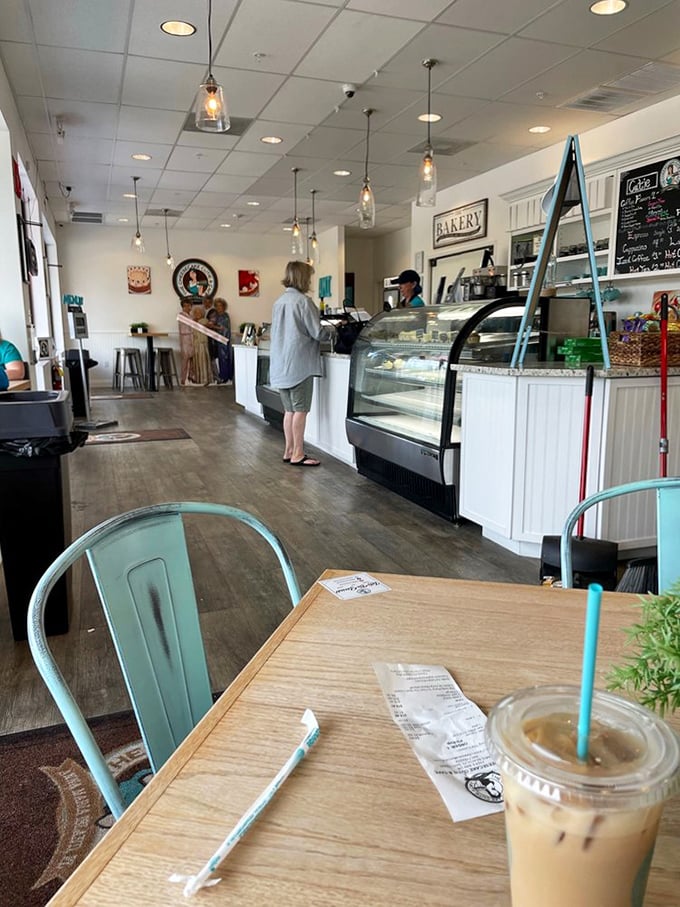 Bright, airy, and welcoming &ndash; the caf&eacute;'s clean design features pendant lighting and a counter that showcases their tempting treats.