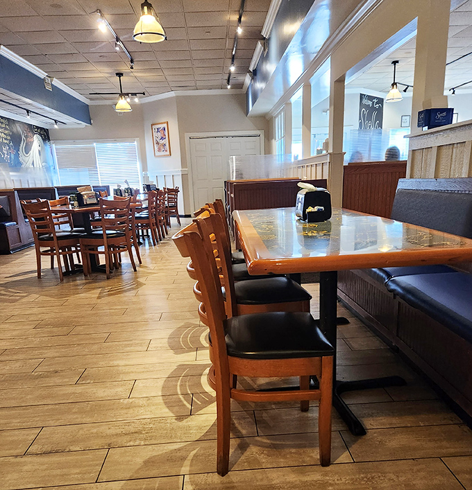 Warm wooden tables and comfortable seating create that perfect "come as you are" atmosphere where memorable meals and conversations flow naturally.