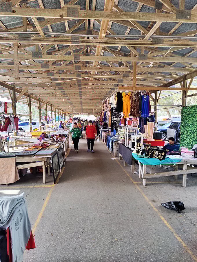 Step into the covered market corridors where colorful clothing displays and eager shoppers create the perfect flea market symphony.