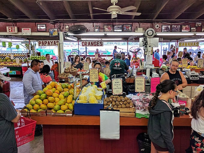 Bustling with curious food lovers, this fruit stand transforms shopping into a vibrant social experience worth savoring.