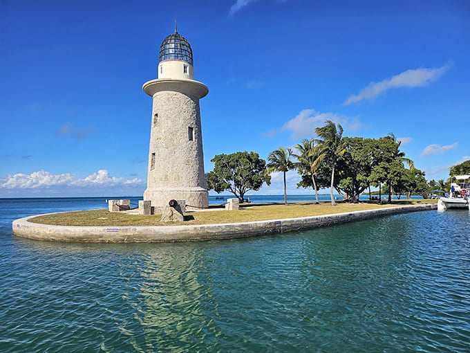 That lighthouse stands guard over Biscayne's crystal waters, a beacon that's guided boats safely through these islands for generations.