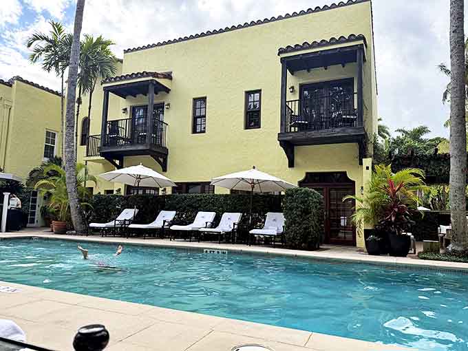 The Brazilian Court Hotel's sunny yellow facade and wrought-iron balconies create a Spanish-inspired retreat in the heart of Palm Beach.