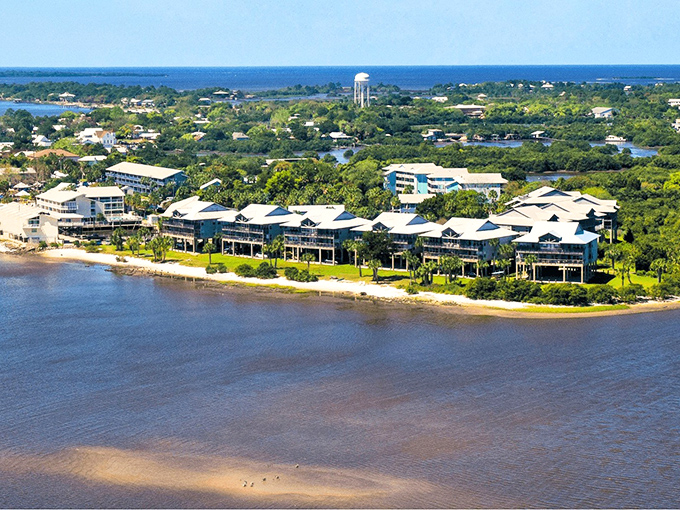 Cedar Key's waterfront buildings perch on stilts above the Gulf, creating a postcard-perfect scene of Old Florida charm.