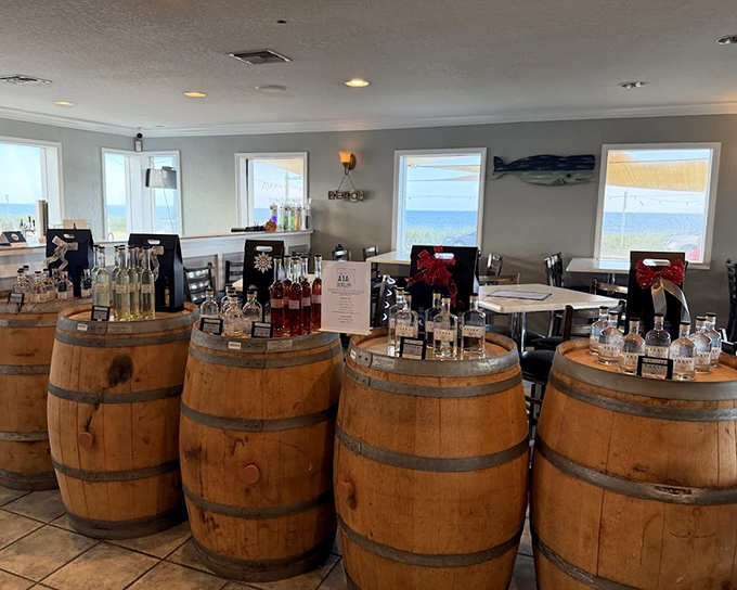 Wine barrels line the tasting room at Flagler Beachfront Winery, each holding liquid treasures with ocean views on the side.