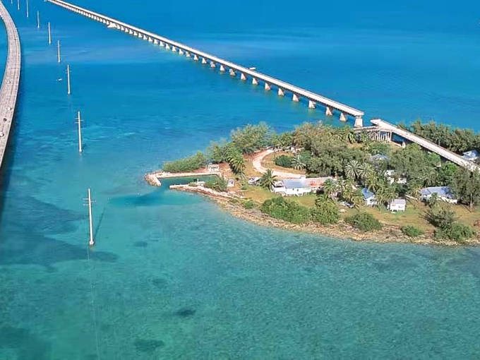 The iconic Overseas Highway bridges connect the Florida Keys like a concrete necklace, with impossibly blue waters stretching to the horizon.