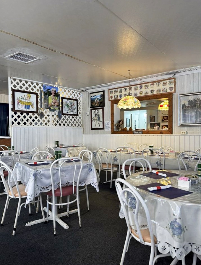 Inside Emmy's, white tablecloths and homey decor create a nostalgic dining atmosphere. Those stained glass lamps cast a warm glow over countless family meals.
