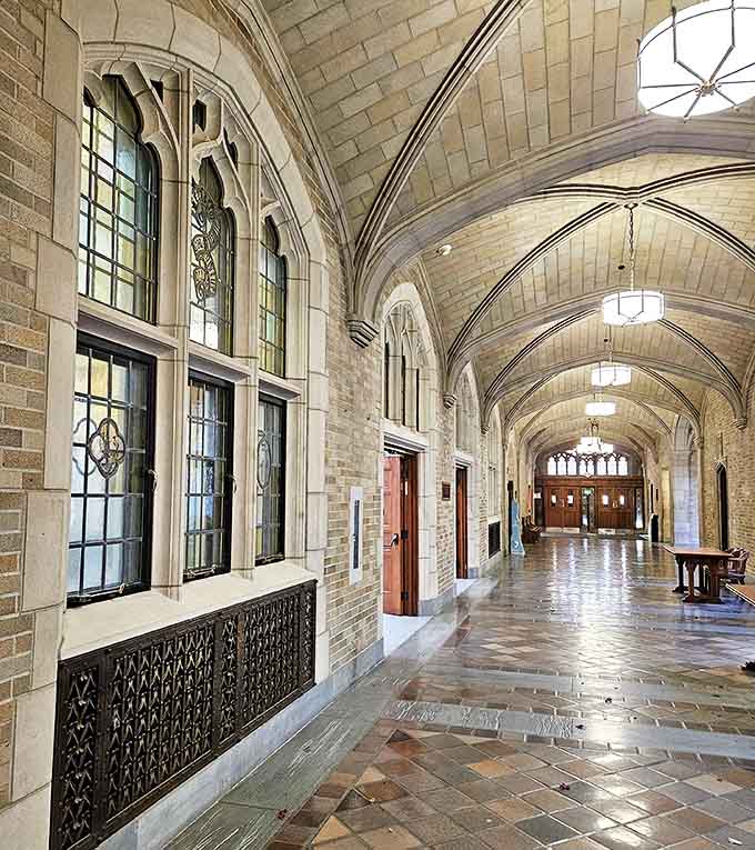 Sunlight streams through this vaulted hallway, casting geometric shadows across limestone floors that have witnessed generations of scholarly footsteps.