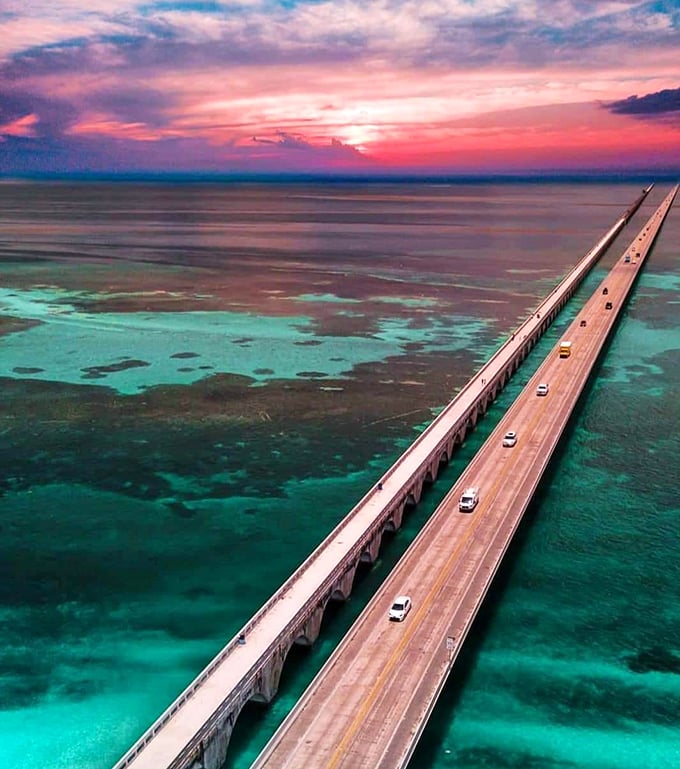 The iconic Seven Mile Bridge stretches across impossible blues, connecting islands while offering one of America's most spectacular driving experiences.