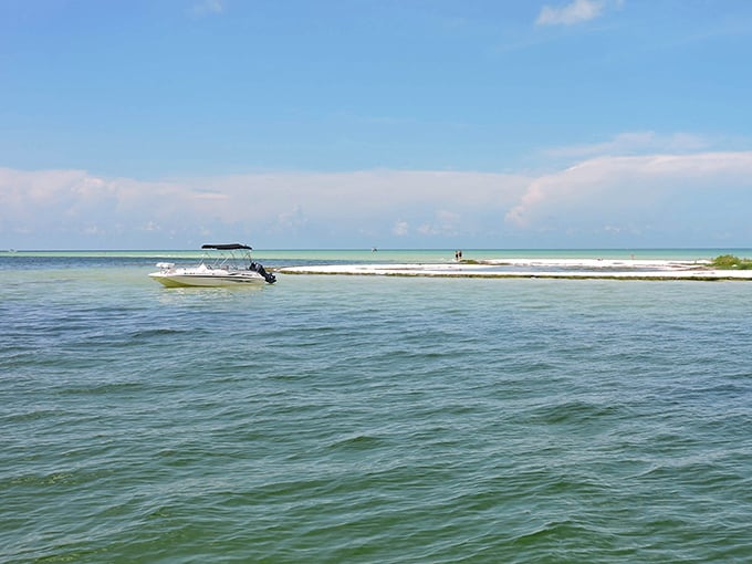 Coastal serenity: Where boats anchor and worries drift away on turquoise tides.