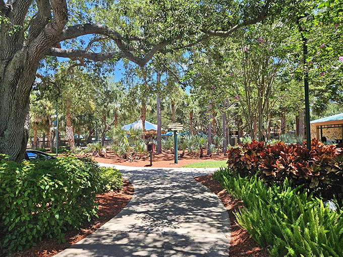 Nature's embrace: Shaded pathways wind through native Florida landscapes, offering a peaceful retreat when playground excitement needs a breather.