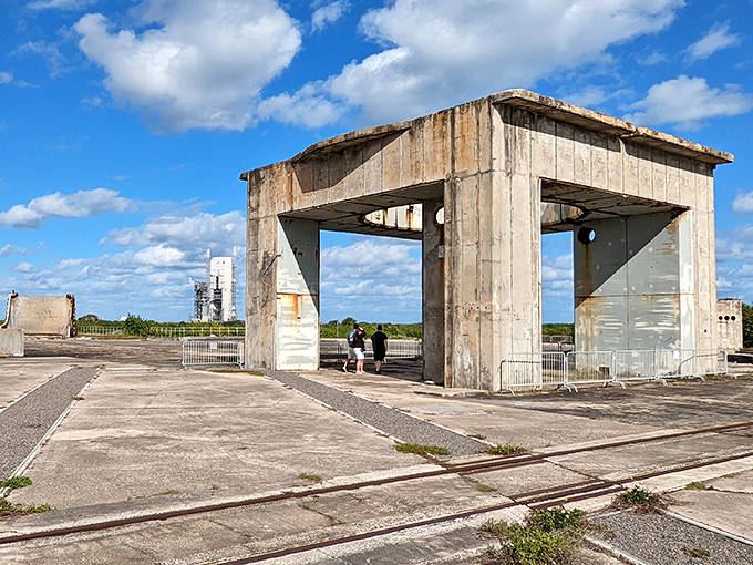 The abandoned concrete structures of Launch Complex 34 stand as a solemn memorial to the Apollo 1 astronauts, where visitors report unexplained sounds and temperature drops.