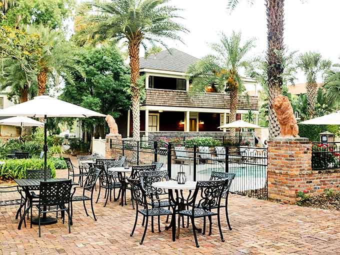 Brick pathways wind through The Collector's gardens, connecting nine historic houses into one charming romantic retreat.