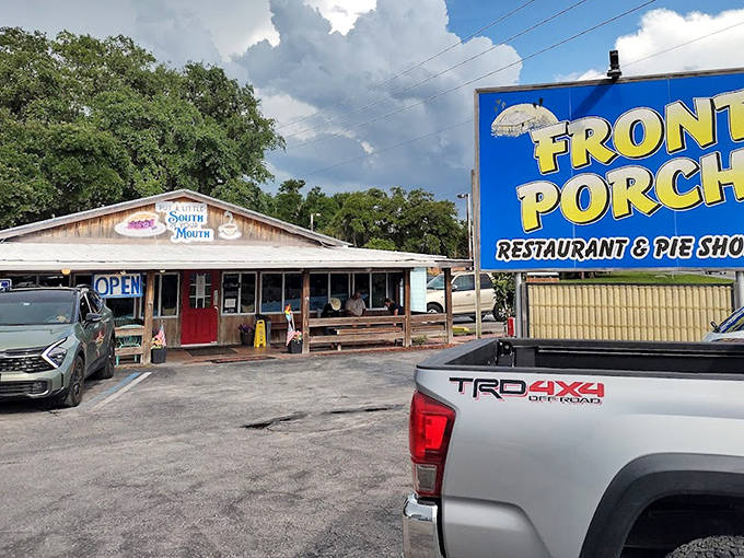The Front Porch Restaurant's weathered wooden exterior promises authentic Southern comfort food in a setting that feels like coming home.