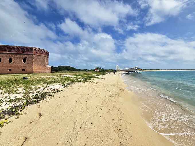 The beach wraps around the historic fort, creating a unique blend of history and tropical beauty.