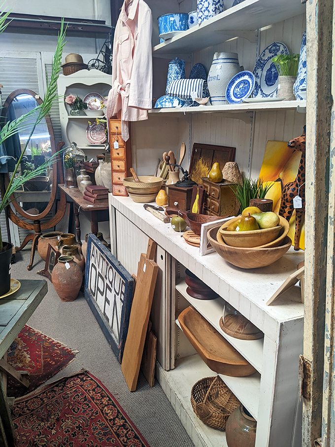 Vintage wooden bowls and blue china wait patiently for their second act&mdash;ready to star in someone's farmhouse kitchen revival.