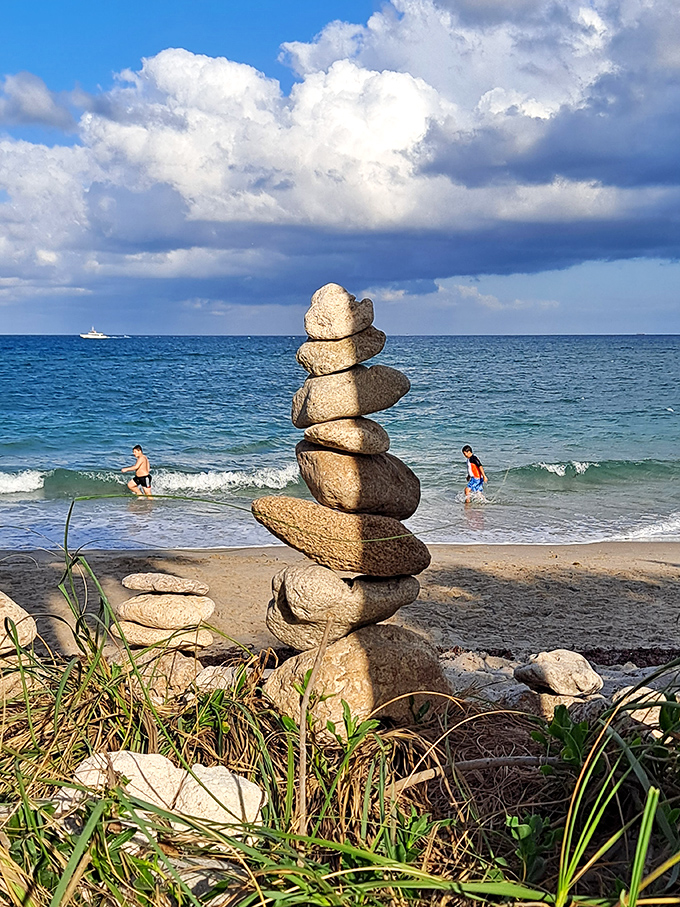 Balanced stones tell silent stories of visitors past &ndash; these temporary sculptures stand as meditative monuments to moments of beach zen.