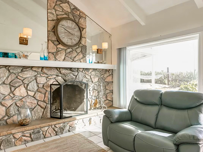 Stone fireplace warmth meets coastal cool &ndash; perfect for those rare evenings when paradise needs a touch of coziness.