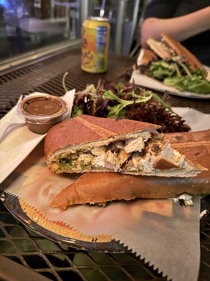 The Grinderman sandwich &ndash; a pressed masterpiece of chicken, pesto, and goat cheese that makes lunch feel like a mini-vacation from reality.