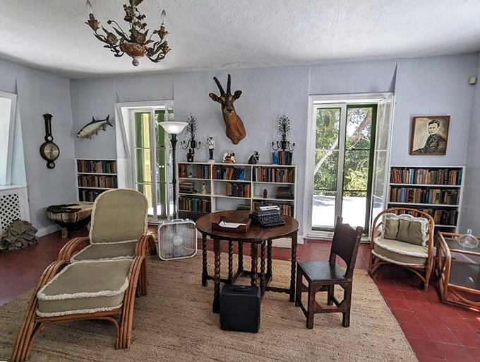 Hemingway's creative sanctuary, where literary giants were born amid bookshelves, hunting trophies, and that famous typewriter.