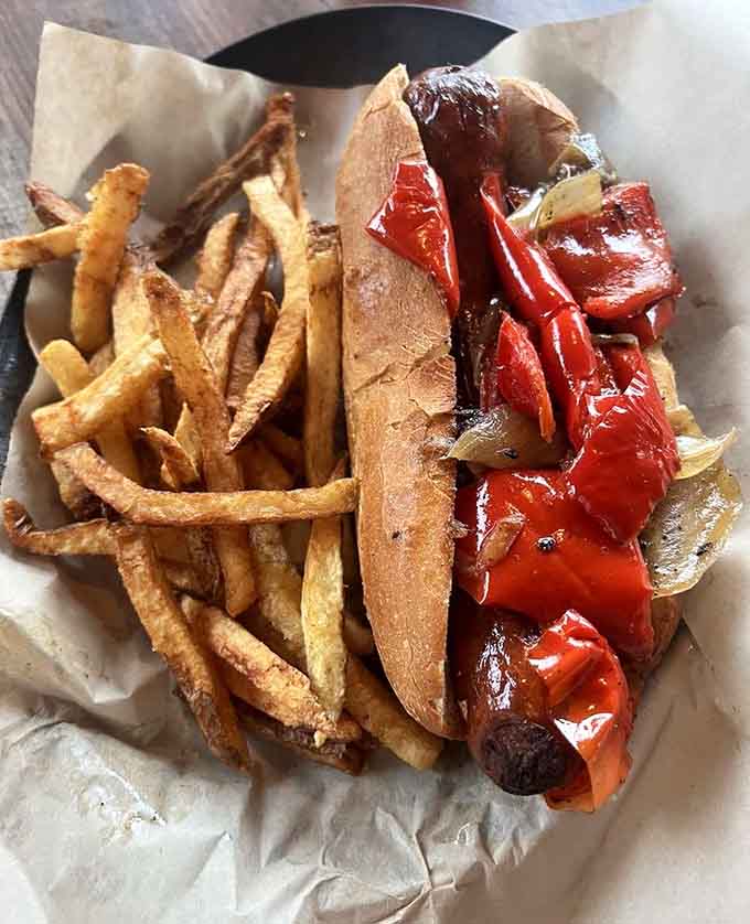 The Italian Sausage Dog arrives loaded with peppers and onions, proving that sometimes simple combinations create the most satisfying results.