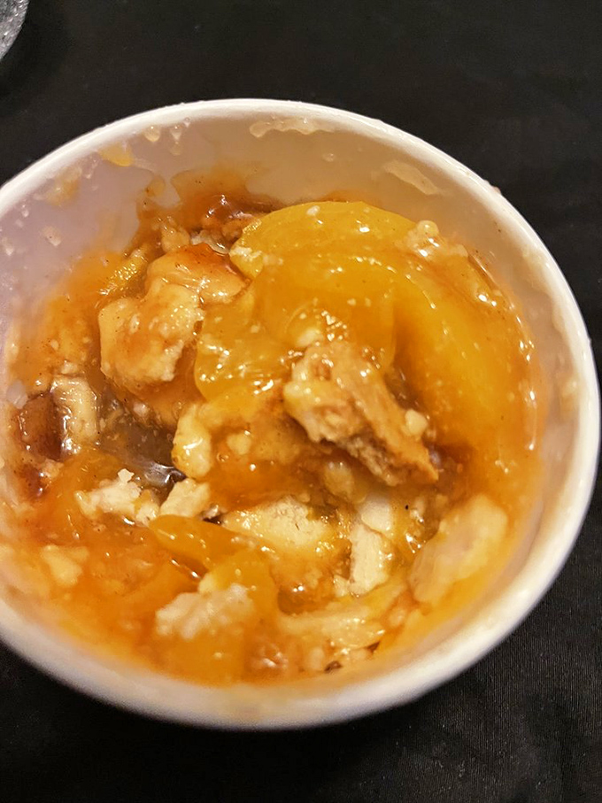 Classic peach cobbler in all its glory &ndash; tender fruit nestled under golden crust, waiting for that first magical spoonful.