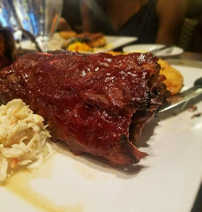 These fall-off-the-bone ribs aren't just smoked, they're serenaded to tender perfection with a Memphis BBQ sauce that'll make you weak in the knees.