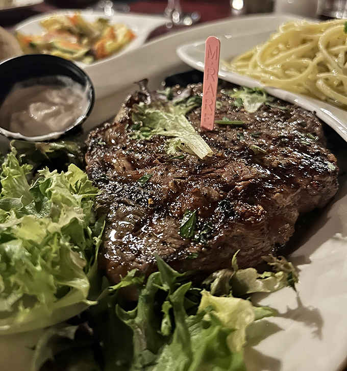 This isn't just any steak &ndash; it's a perfectly seasoned rib eye that proves Cap's Place respects the land's bounty as much as the sea's offerings.