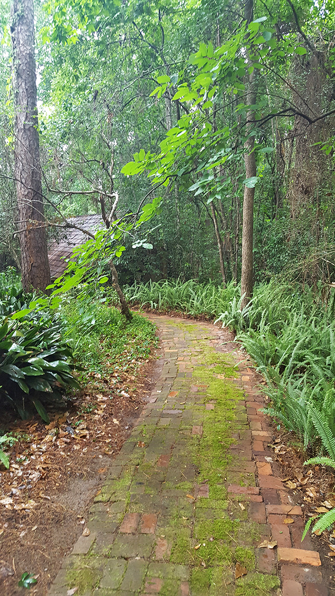 Brick pathways meander through the property like breadcrumb trails, each one promising a different mini-adventure around the bend.
