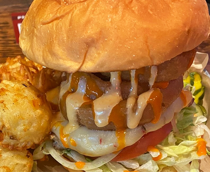 This isn't just lunch, it's an edible masterpiece &ndash; layers of flavor stacked between buns with melty cheese cascading down the sides.