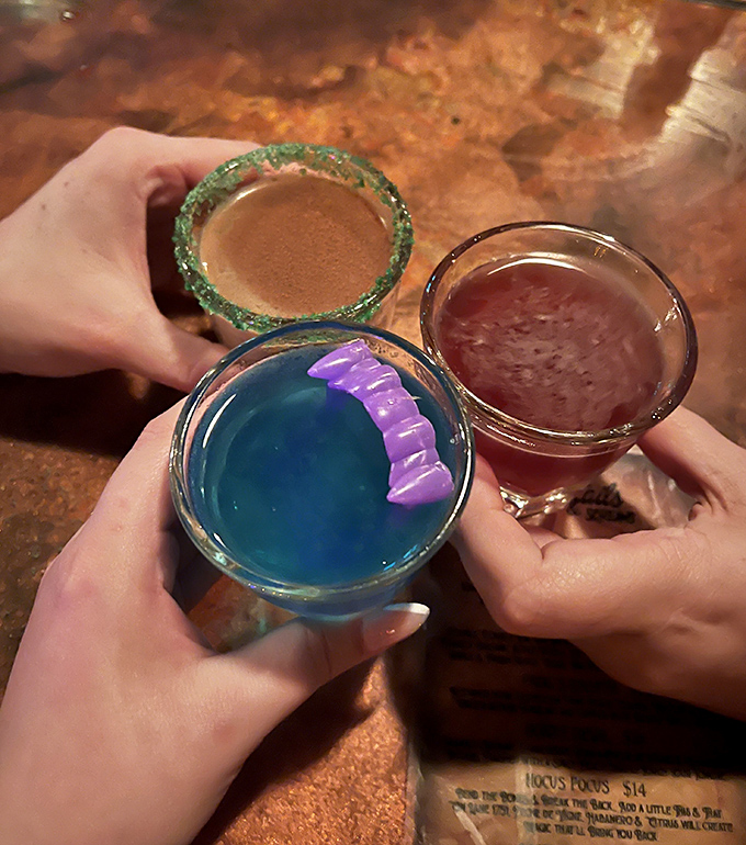 A toast to the macabre! These colorful shots showcase the bar's playful approach to mixology, with vibrant hues and creative presentations.