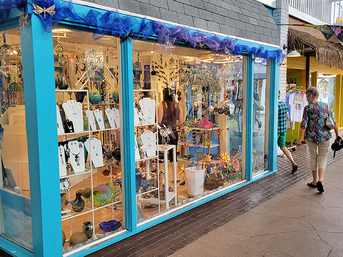 Colorful boutique windows beckon with treasures that whisper, "Yes, you absolutely need another sea-themed trinket for your guest bathroom."