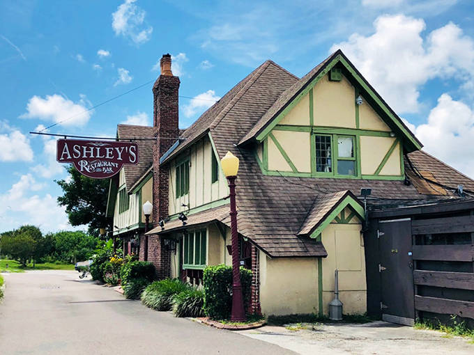 Ashley's of Rockledge welcomes hungry travelers with its charming Tudor-style architecture, though some diners report unexpected company from the restaurant's spectral residents.