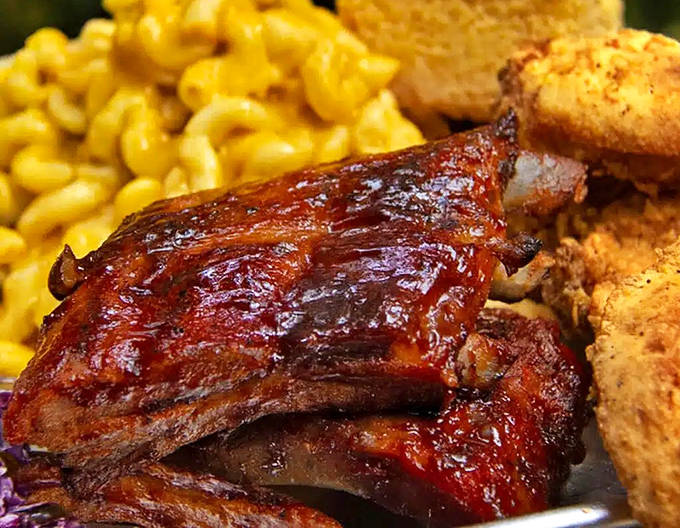 Fall-off-the-bone barbecue ribs glistening with that secret sauce, accompanied by creamy mac and cheese &ndash; a plate that demands both napkins and seconds.